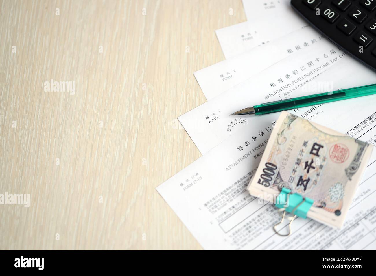 Japanese tax forms lies on table with calculator hi-res stock ...