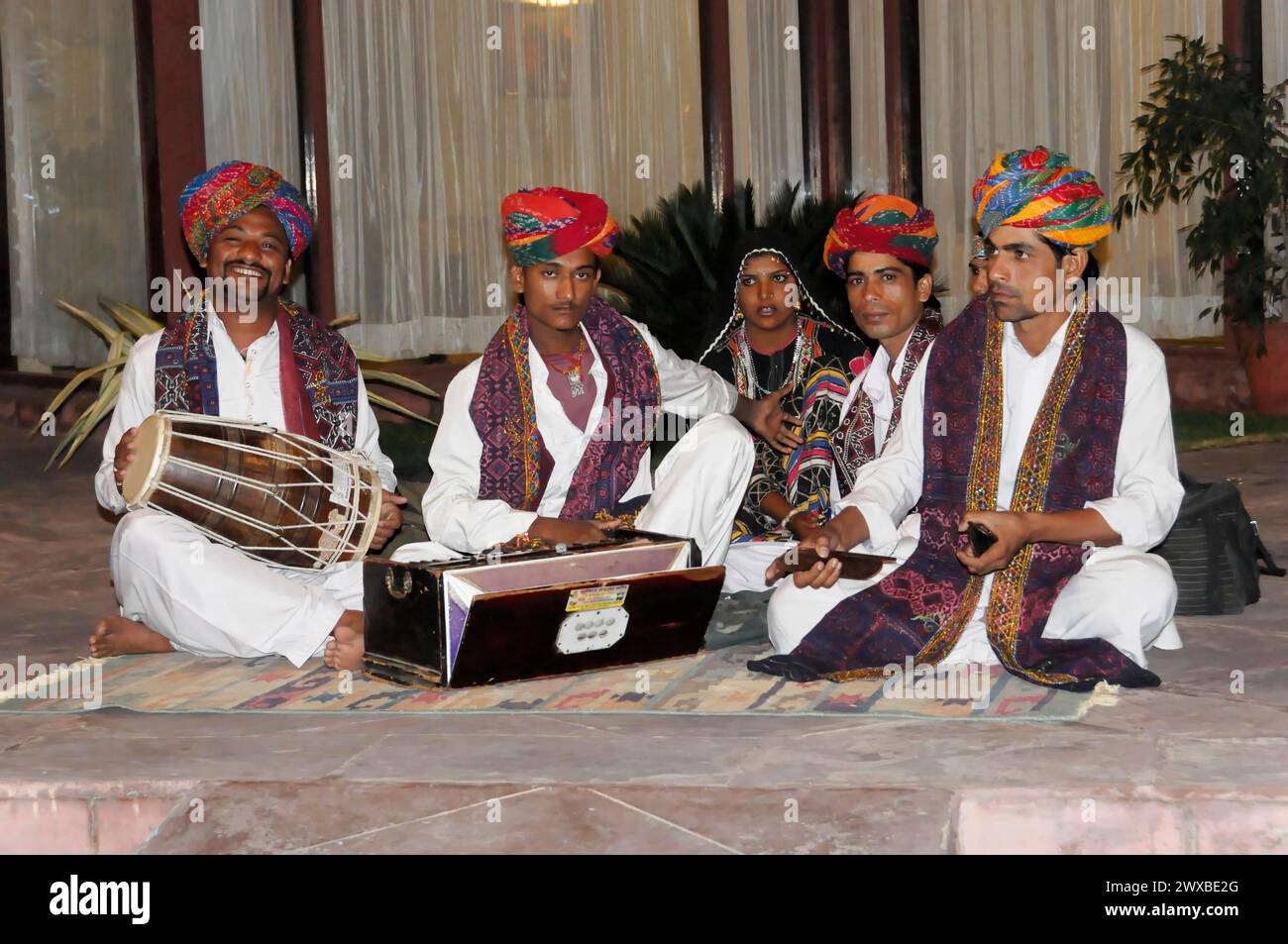 Musicians in traditional costumes playing typical Indian instruments ...