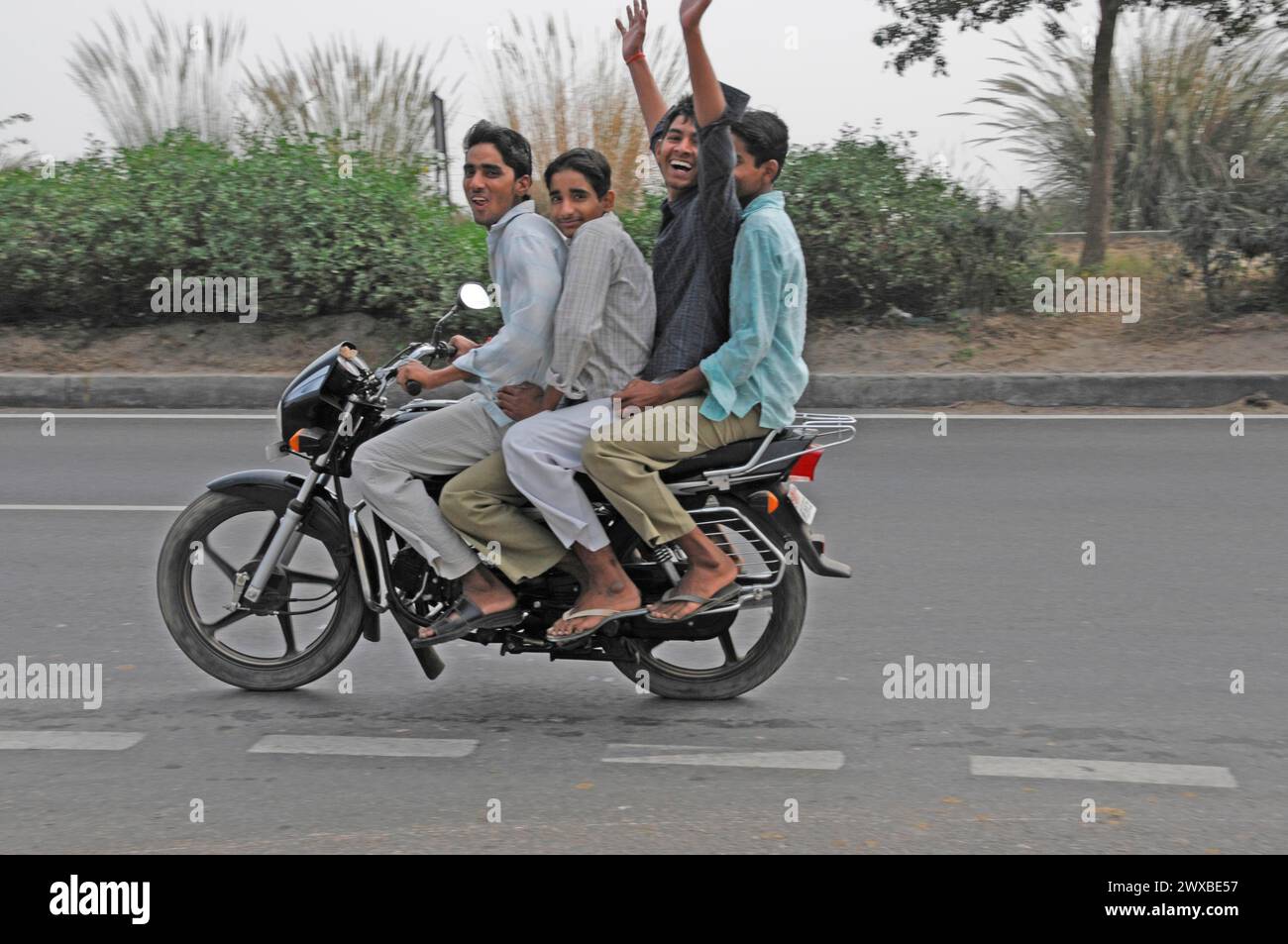 Indian teenager on motorcycle hi-res stock photography and images - Alamy