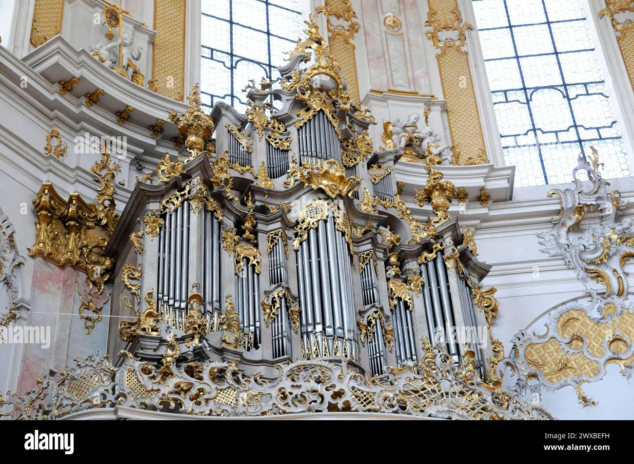 Ettal Monastery, gold-decorated baroque organ with pipes in a church ...