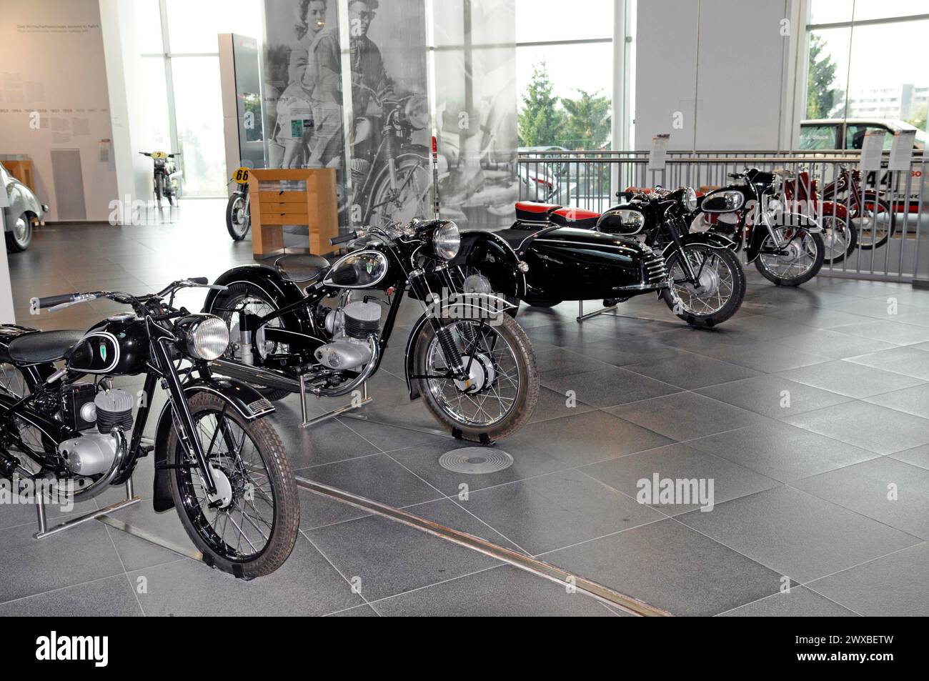 Museum mobile, Audi Museum, A row of vintage motorbikes exhibited in a ...