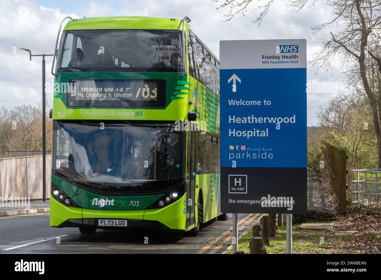 A bus passing the sign at the new NHS hospital, Heatherwood Hospital in ...