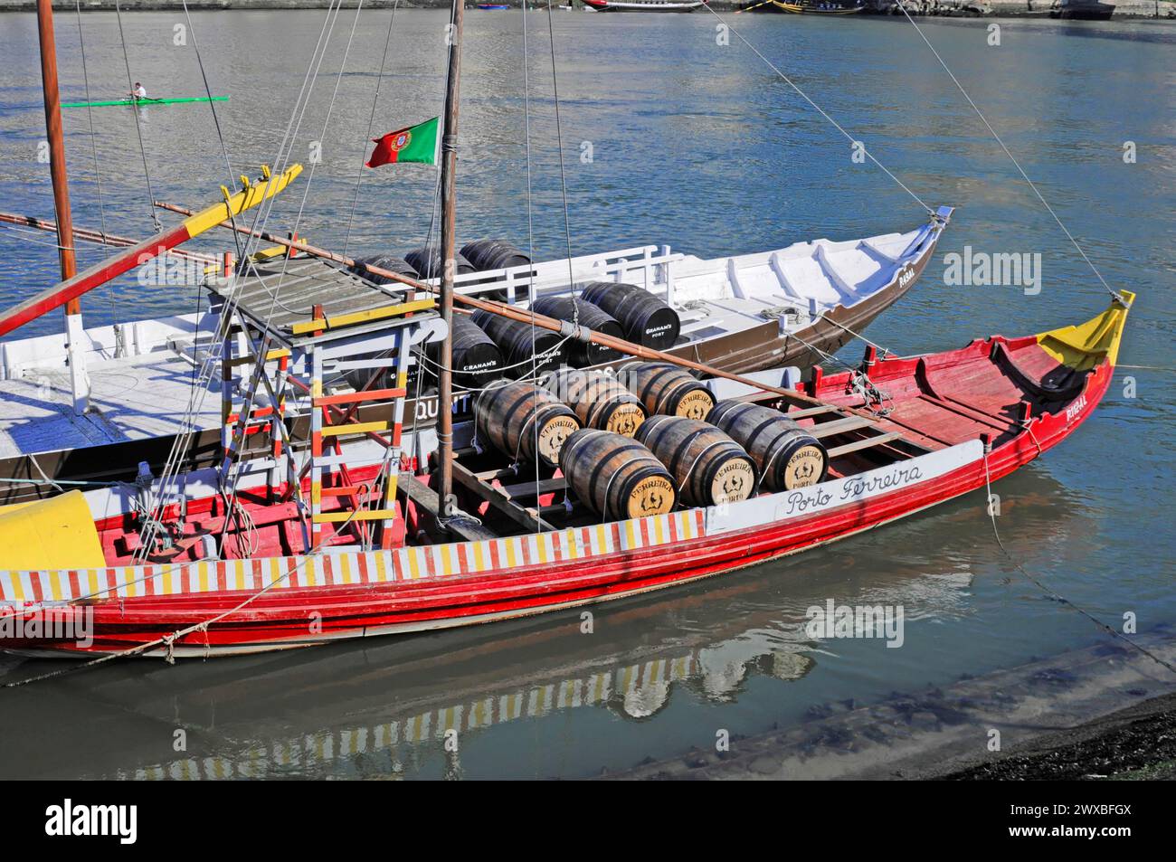Traditional boat with port wine barrels on the Douro in Porto, northern ...