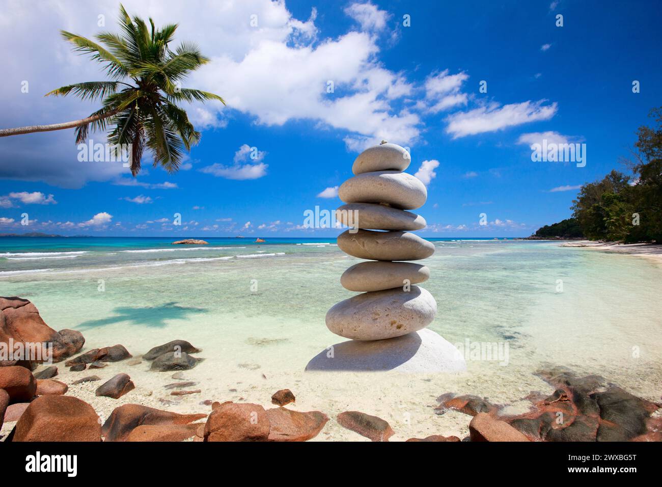 Pebble tower on the beach, Seychelles Stock Photo - Alamy