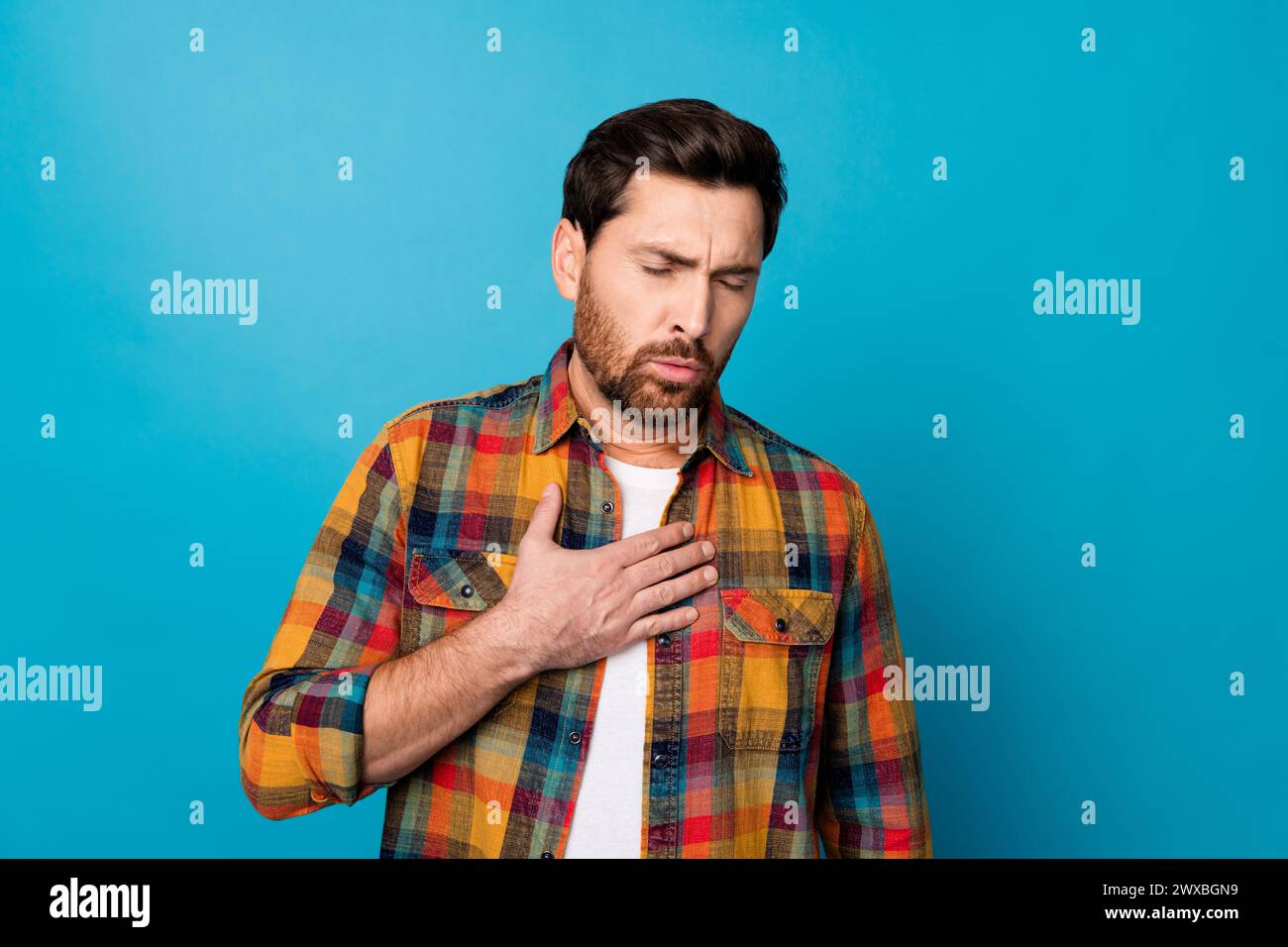 Man chest pain heart attack blue shirt hi-res stock photography and ...