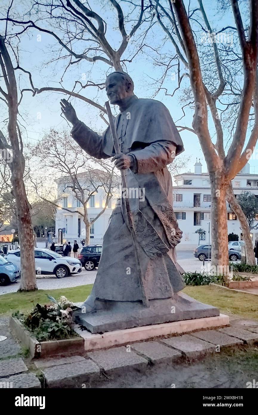 Statue of Pope John Paul II, in Largo da Assuncao, view in sunset ...
