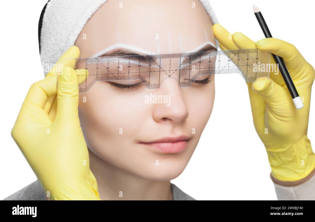 Permanent make-up for eyebrows of beautiful woman with thick brows in ...