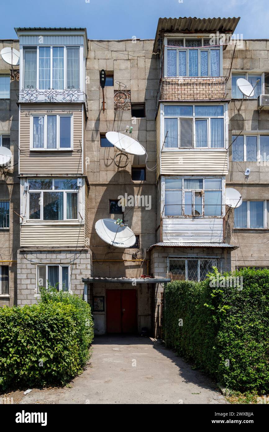 soviet five-storey apartment building with numerous windows and balcony ...