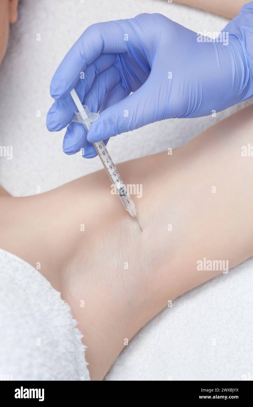 The doctor makes intramuscular injections of botulinum toxin in the ...
