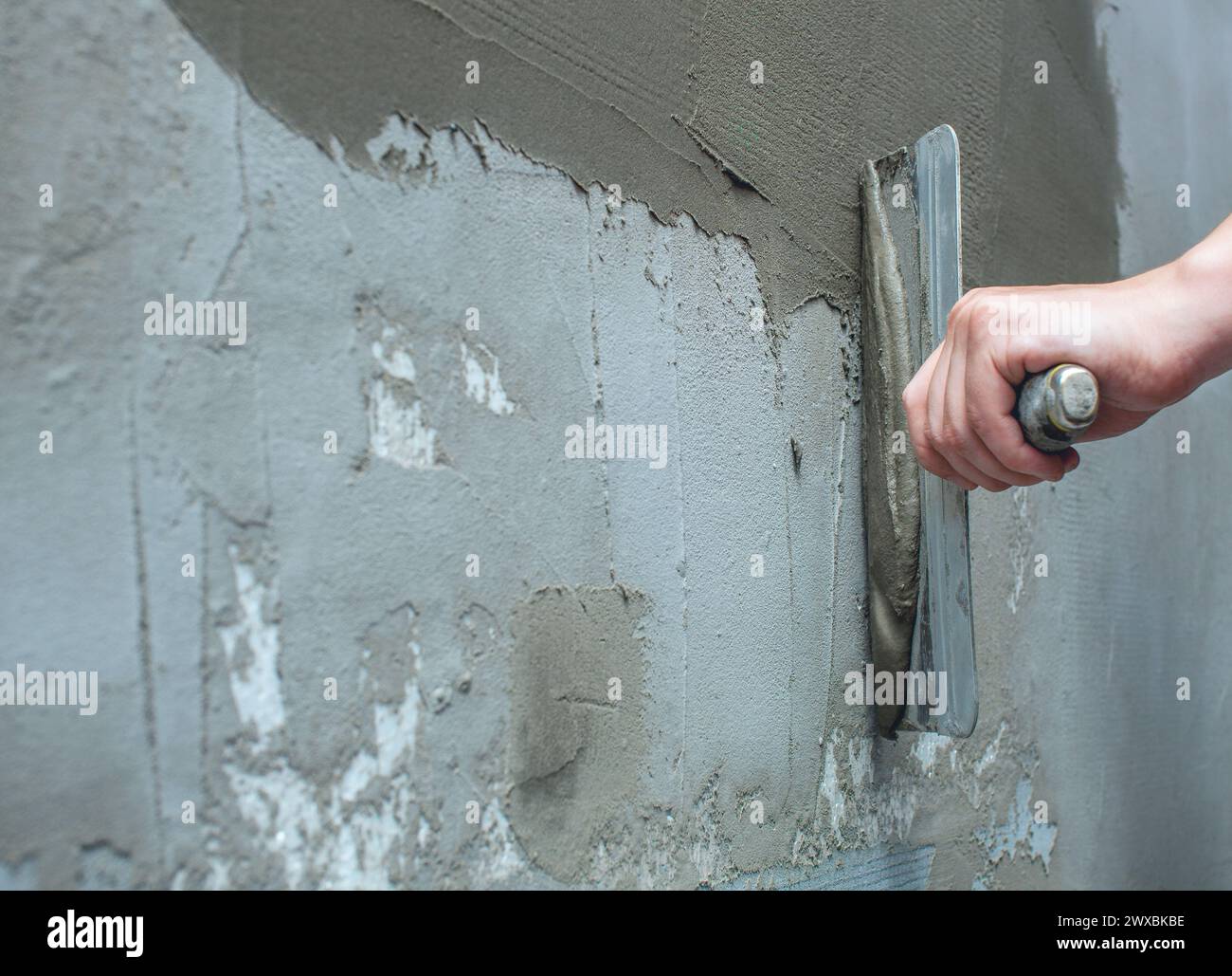 Builder puts mortar trowel wall. Plaster walls. Exterior finish Stock ...