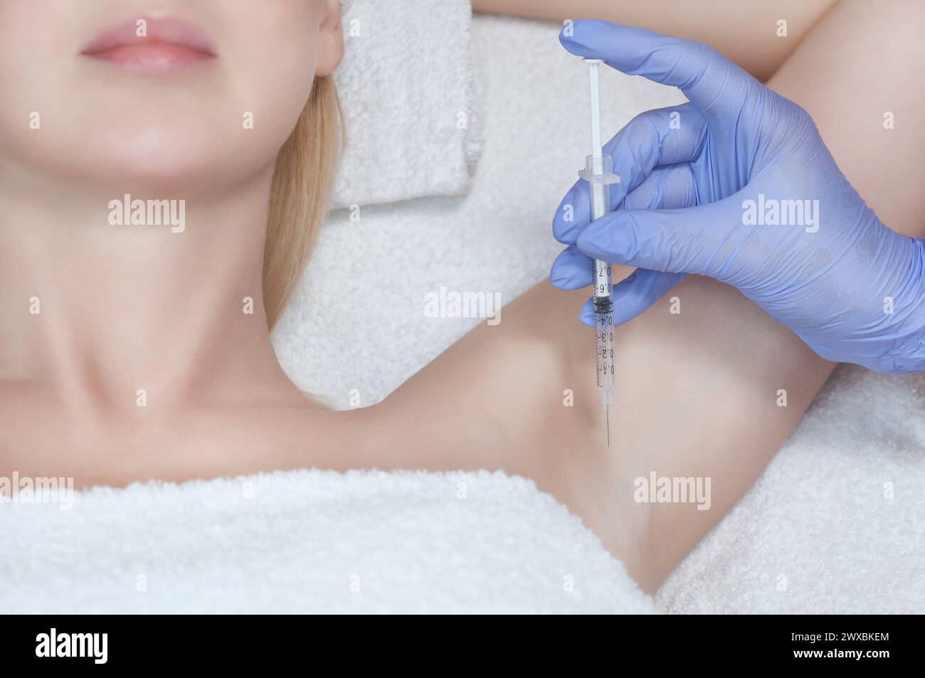 The doctor makes intramuscular injections of botulinum toxin in the ...