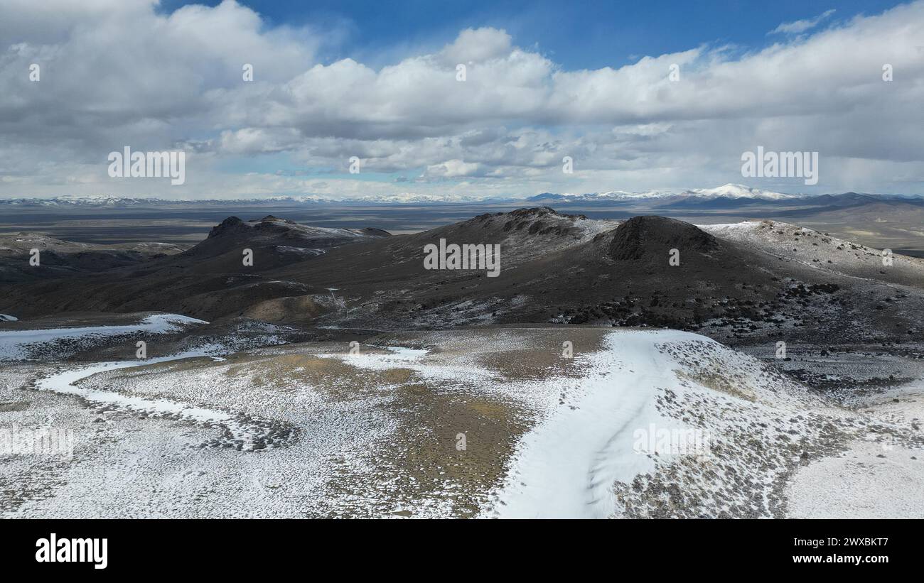 Aerial view of a distant snow-covered hill Stock Photo - Alamy