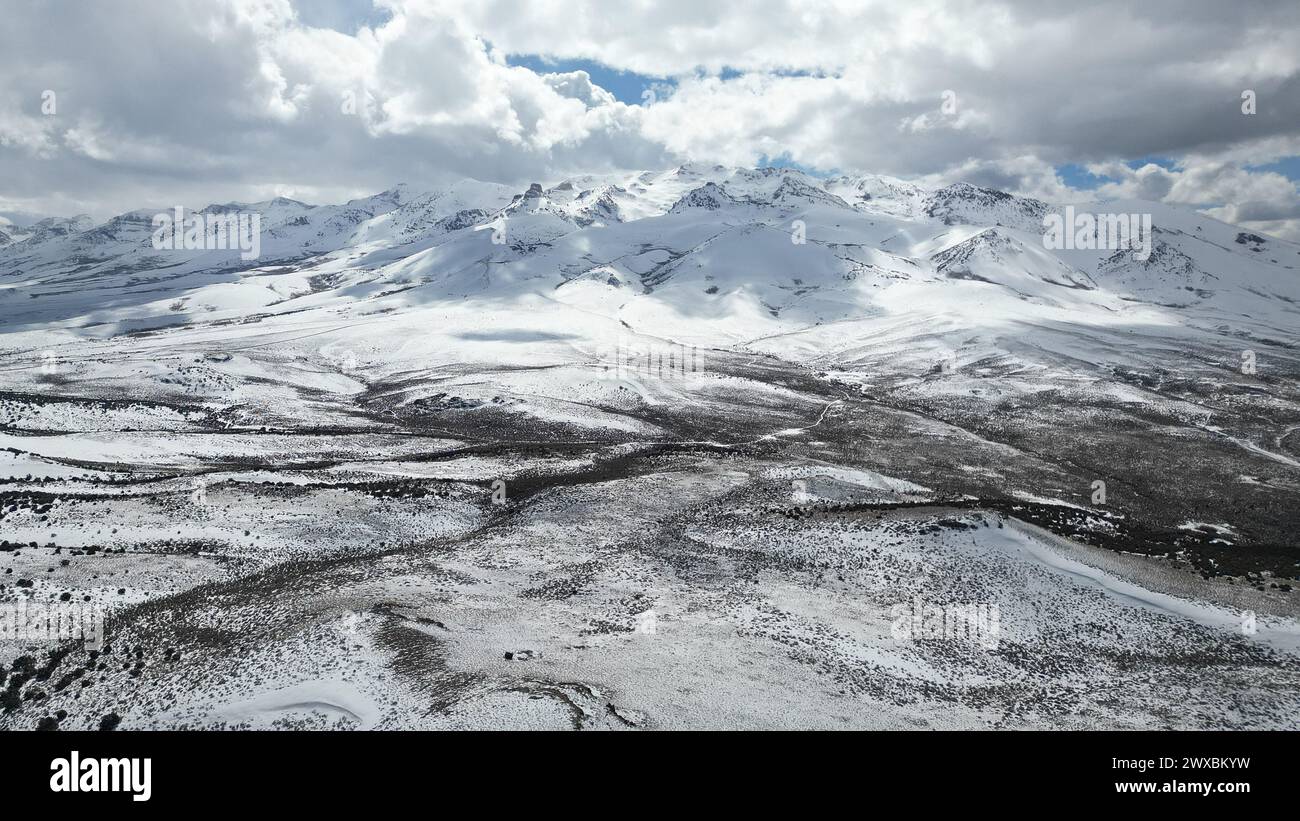 Aerial winter landscape of a snowy valley seen from a helicopter Stock ...