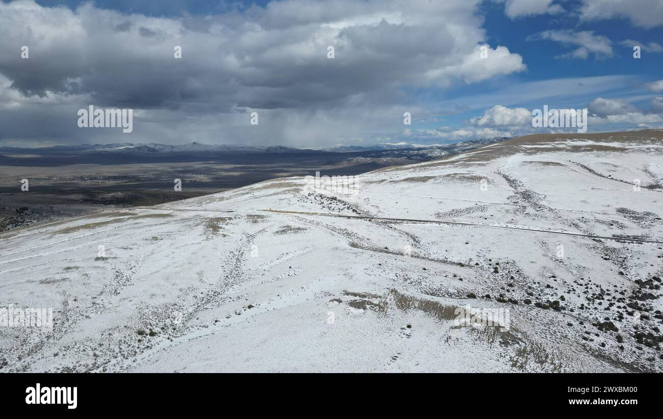 Snow-covered mountains and hills in a vast valley landscape Stock Photo ...