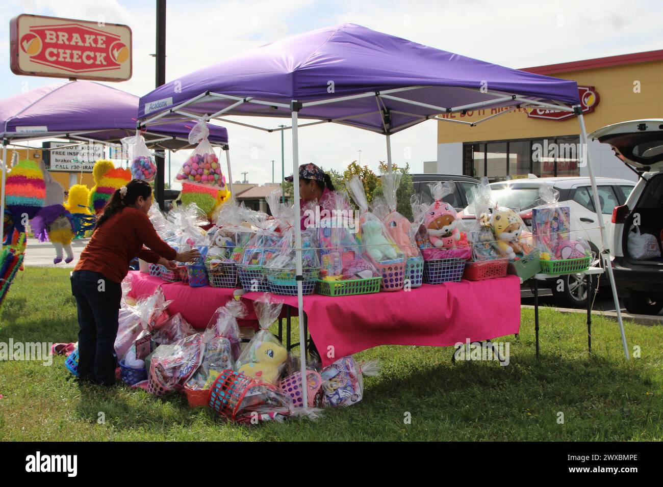 San Antonio, USA. 29th Mar, 2024. An Easter vendor prepares her stand along Marbach Road in San ...
