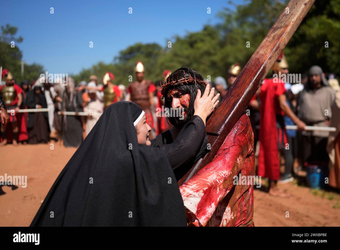 Actors perform in a Way of the Cross reenactment as part of Holy Week ...