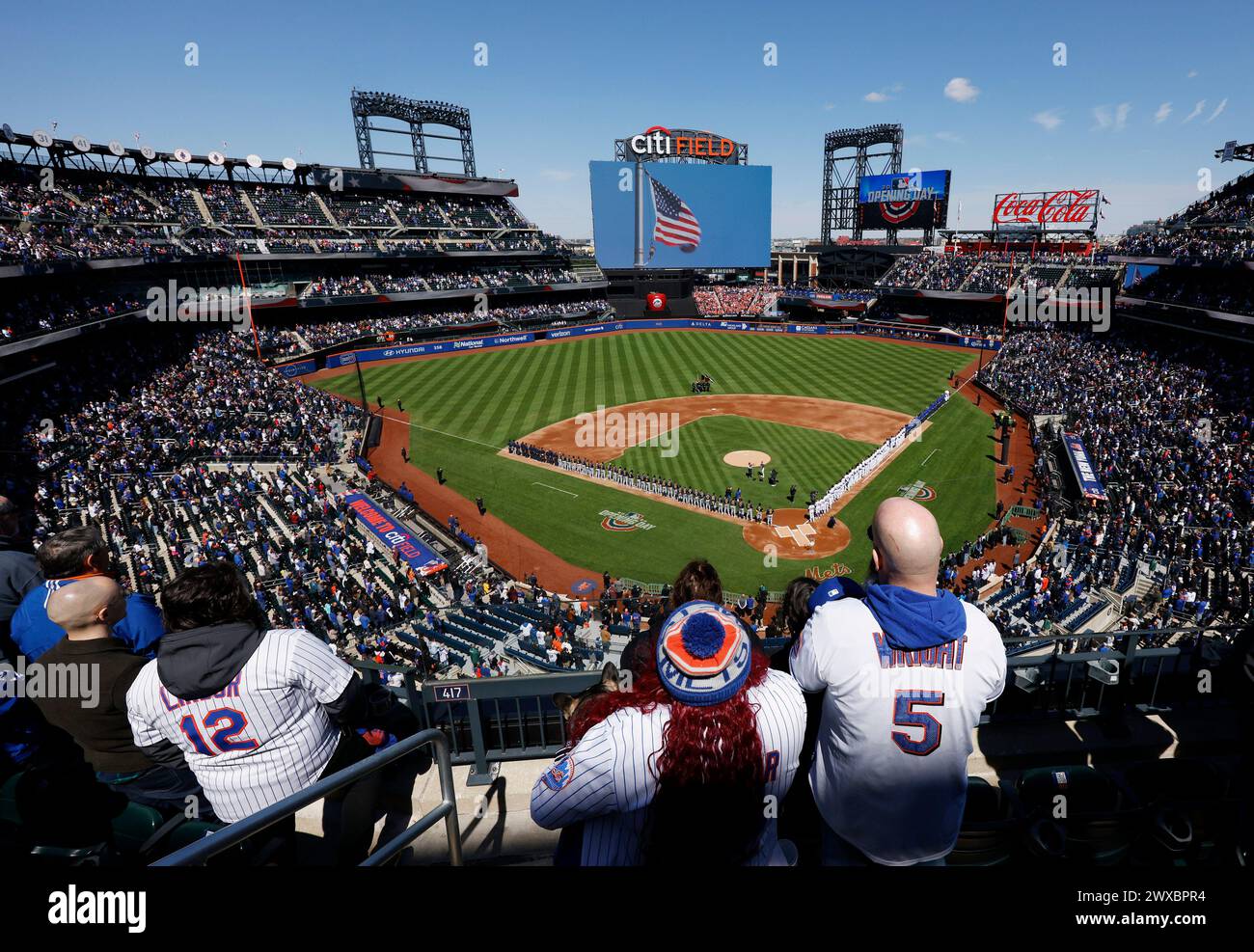 Queens, United States. 29th Mar, 2024. Fans stand for the National ...