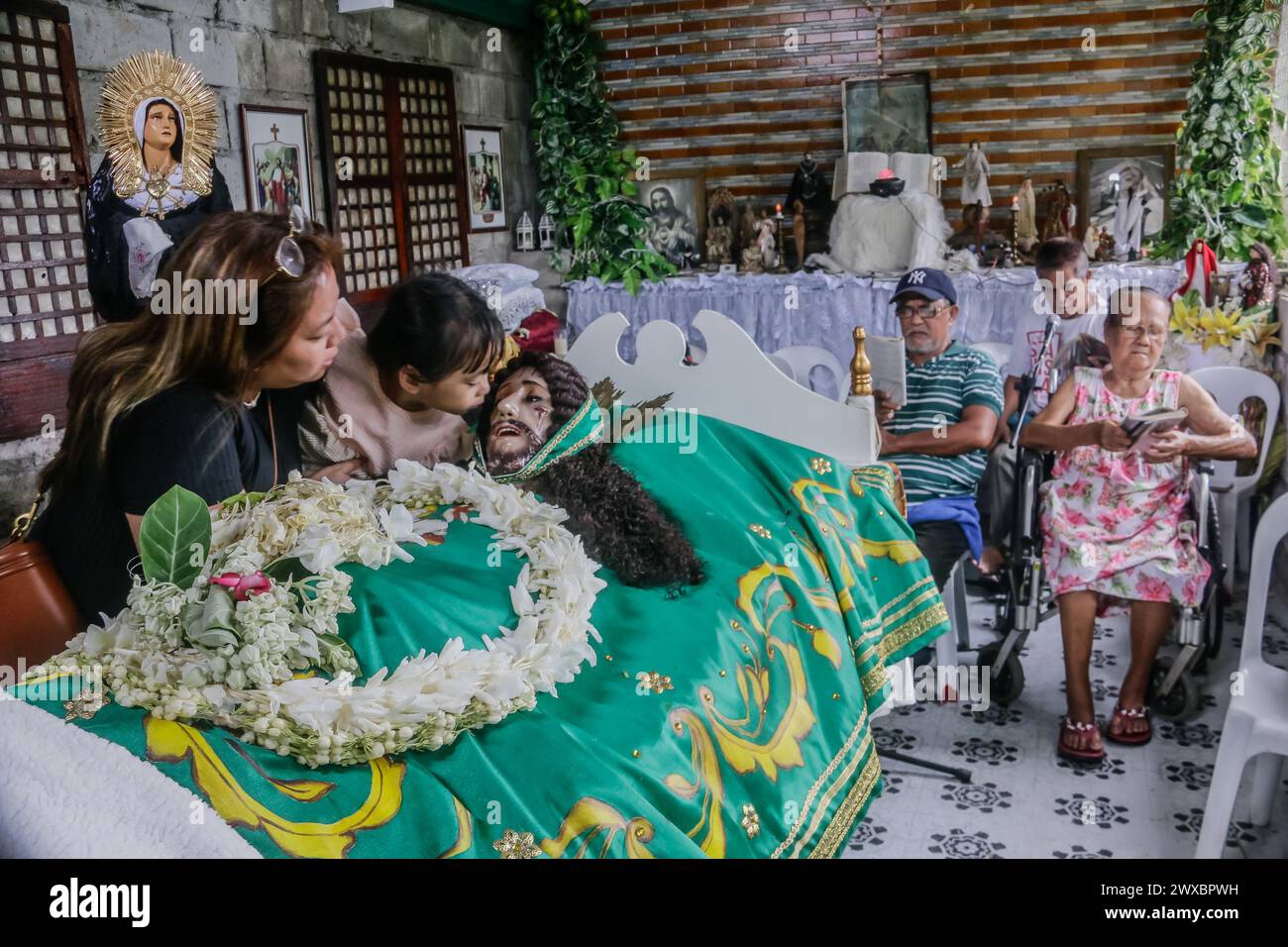 March 29, 2024, Binangonan, Rizal, Philippines: Catholic devotees kiss ...