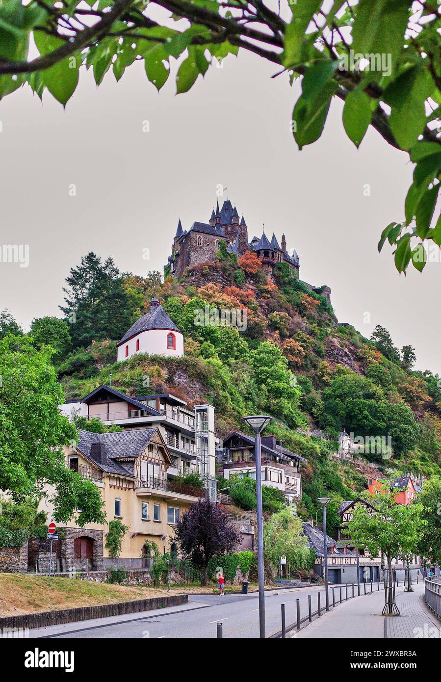 Reichsburg Castle or Cochem Castle high above the town of Cochem on the ...