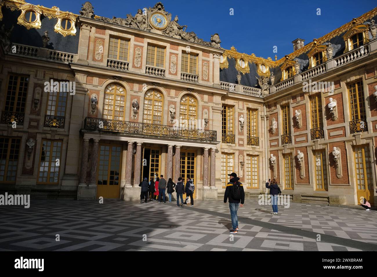 Entrance in the impressive Palace of Versailles, the residence of the ...