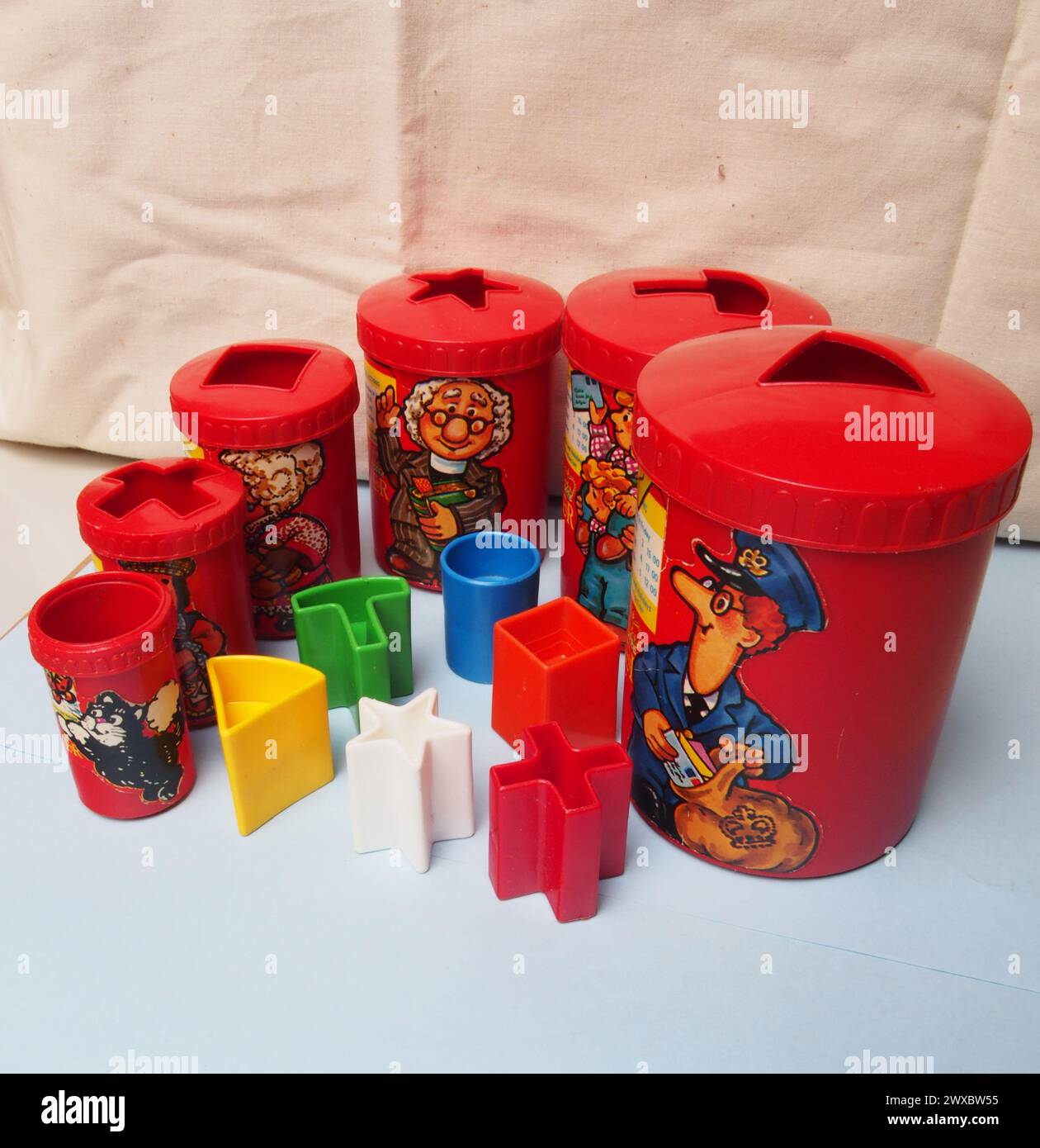 A retro, colourful, Postman Pat shape sorting toy, made with six ...