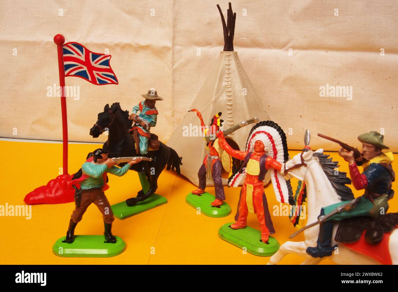 Retro toys of cowboys and red Indians with a teepee and Union Jack flag ...