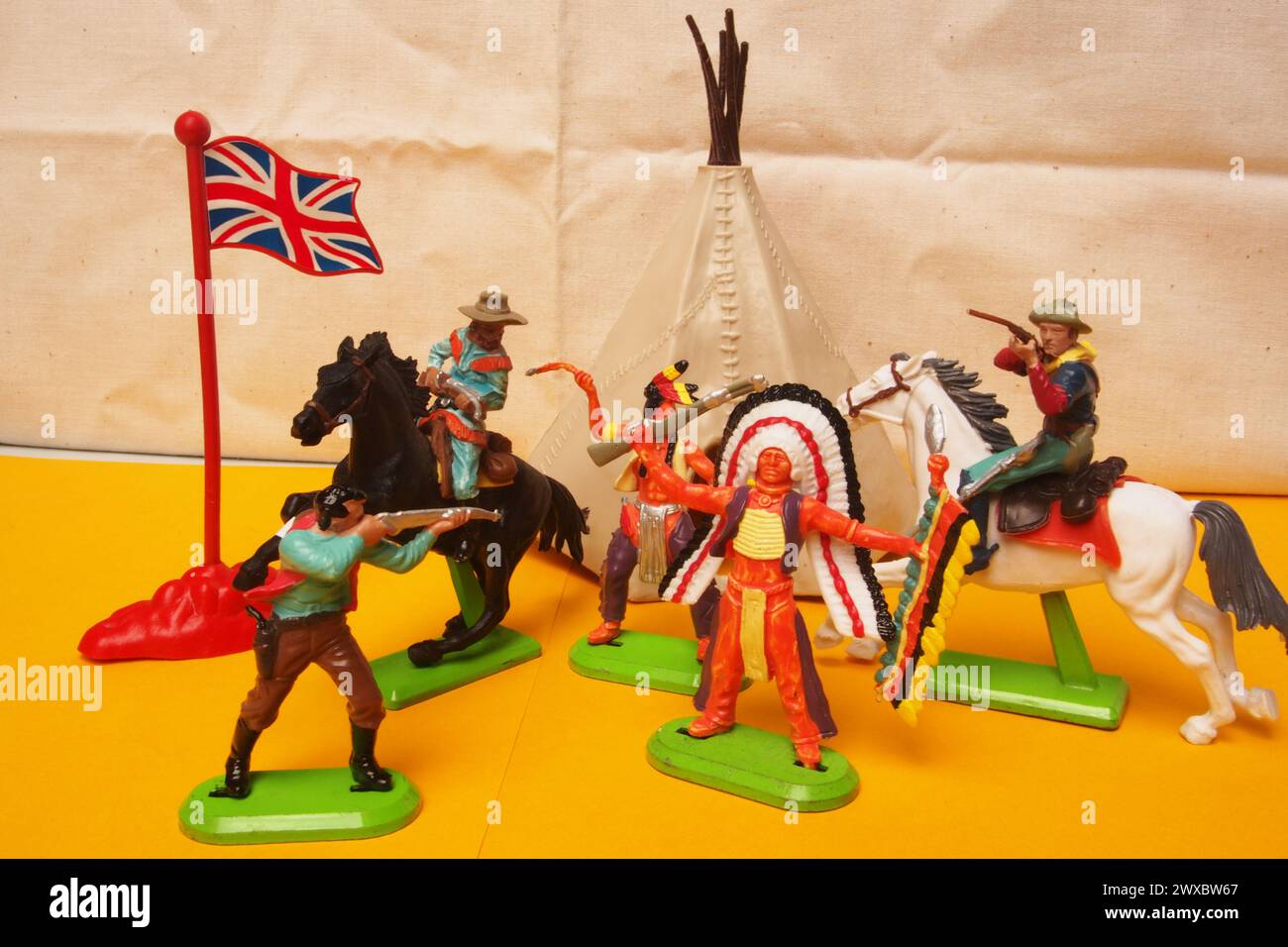 Retro toys of cowboys and red Indians with a teepee and Union Jack flag ...