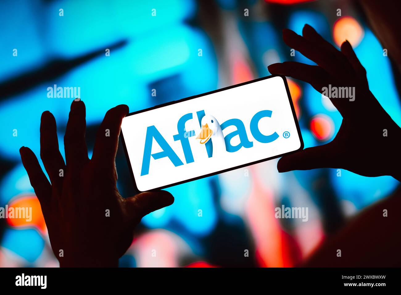 In this photo illustration, the Aflac logo is displayed on a smartphone ...