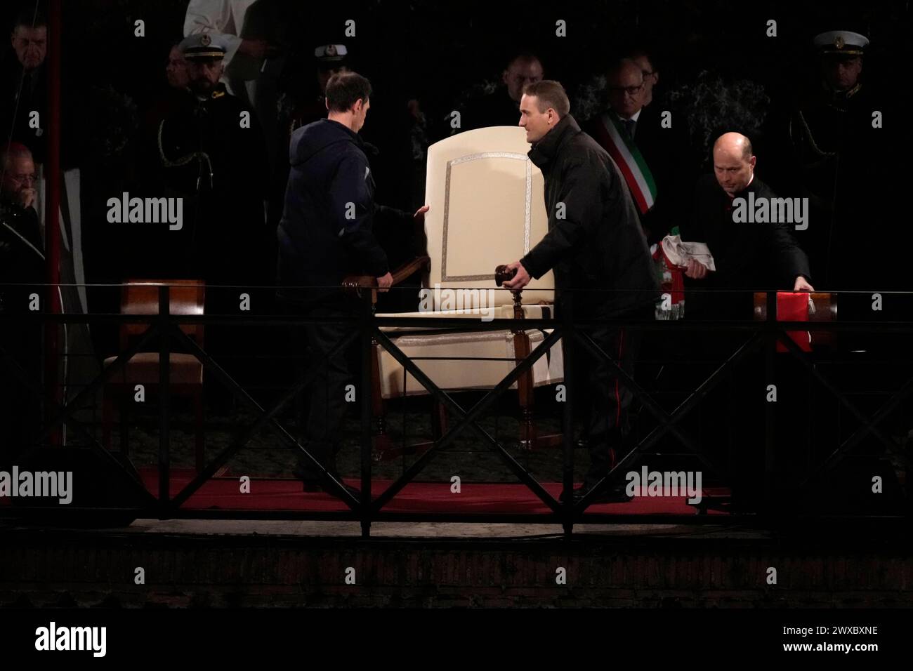Vatican ushers carry Pope Francis chair prior to the start of the Via ...