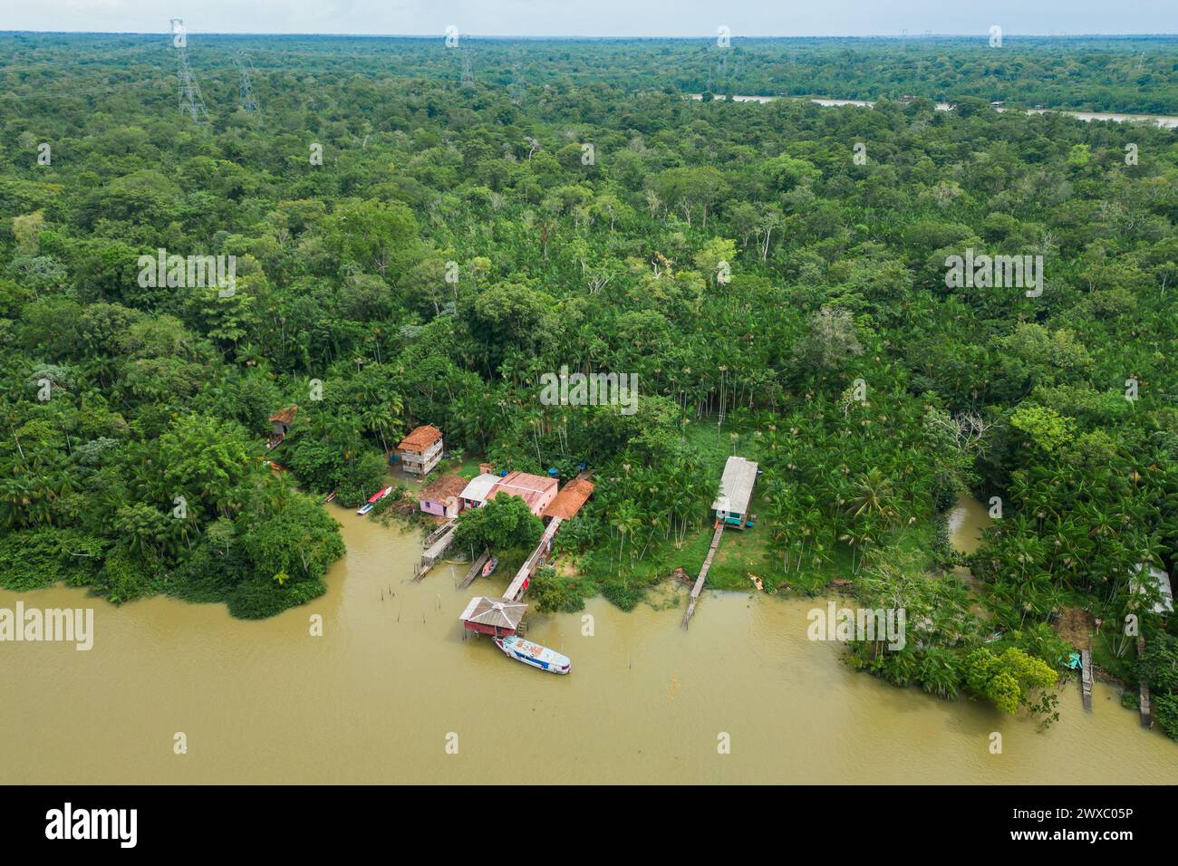 Aerial View of a Small Community Houses in Tropical Rainforest by the ...