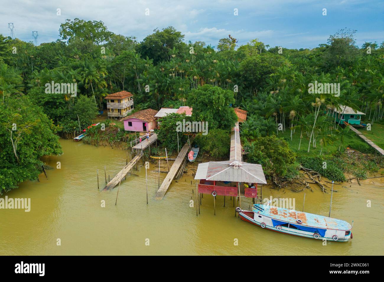 Aerial View of a Small Community Houses in Tropical Rainforest by the ...