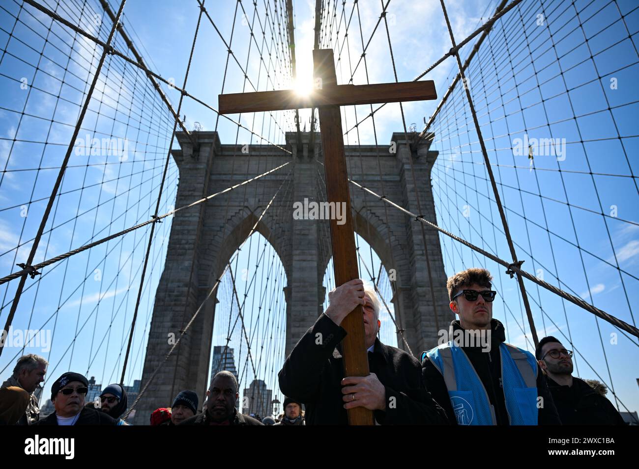 People walk in a procession during The Way of the Cross over the ...