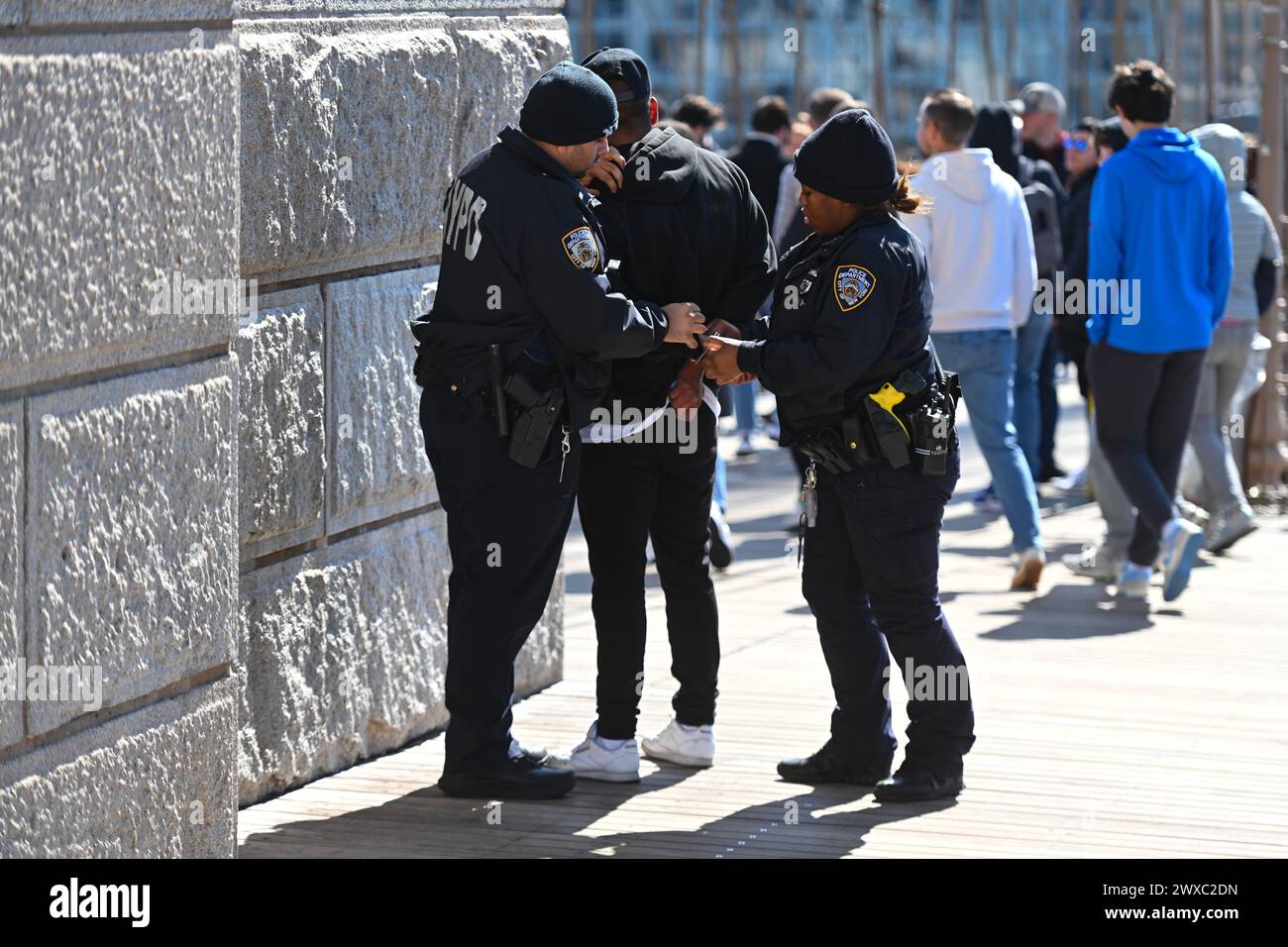 Police officers arrest an emotionally disturbed person on the Brooklyn ...