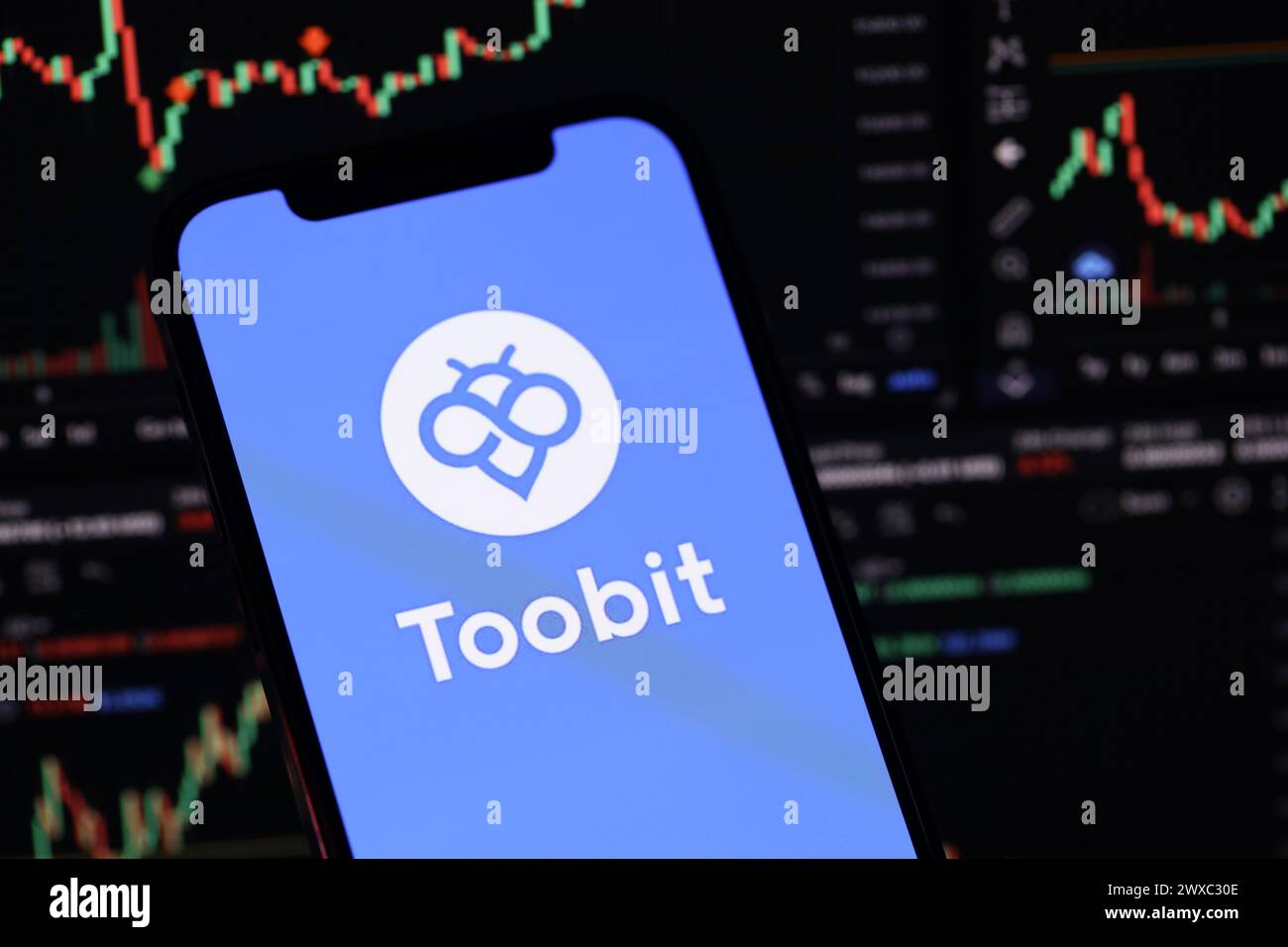 KYIV, UKRAINE - MARCH 15, 2024 Toobit logo on iPhone display screen and ...