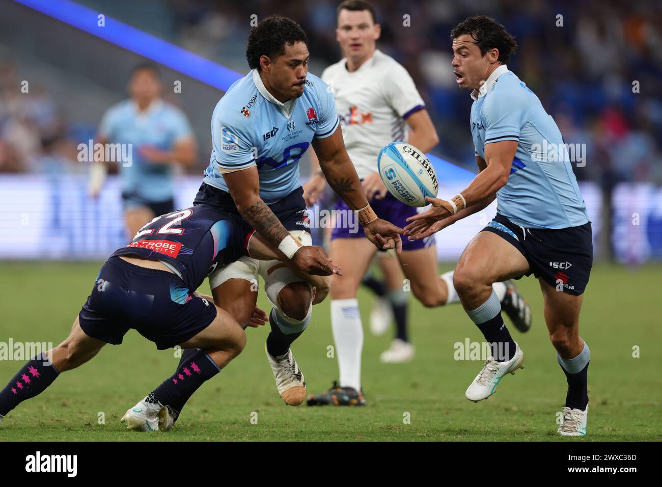Sydney, Australia, 29 March, 2024. Jack Grant of the Waratahs receives ...