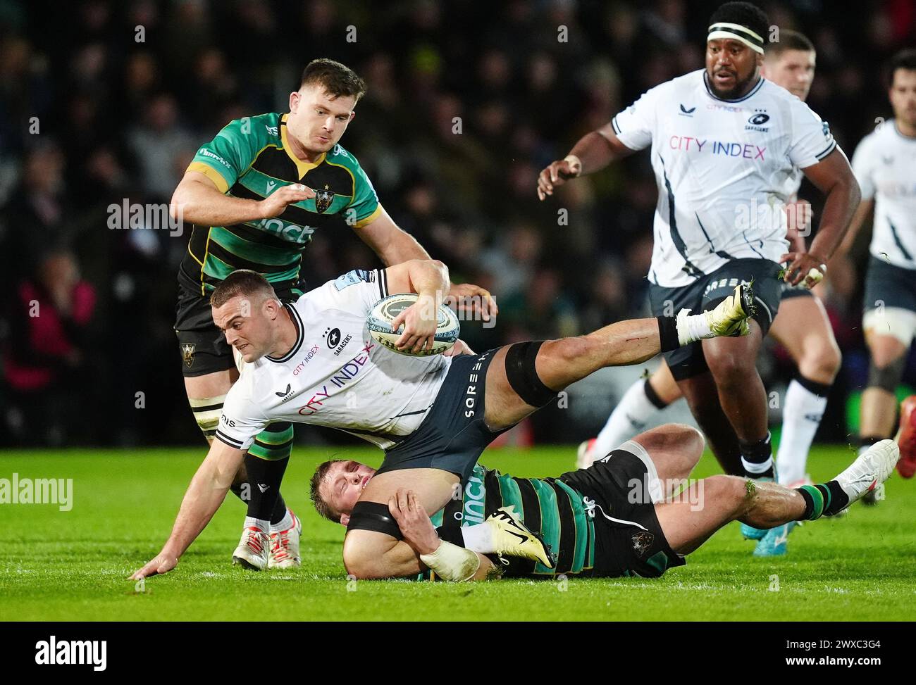 Saracens’ Ben Earl is tackled by Northampton Saints' Alex Waller during ...