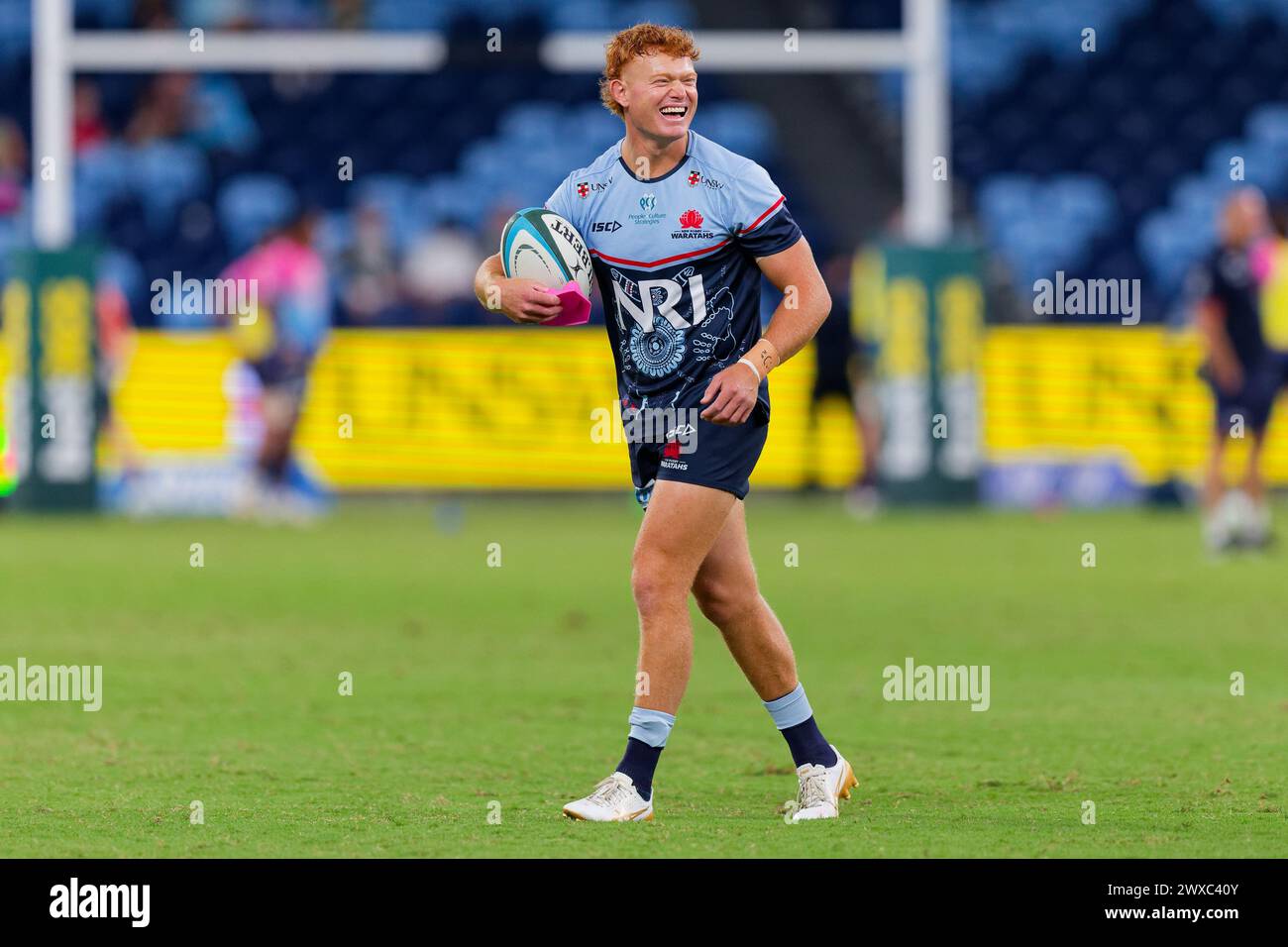 Sydney, Australia. 29th Mar, 2024. Tane Edmed of the Waratahs warms up ...