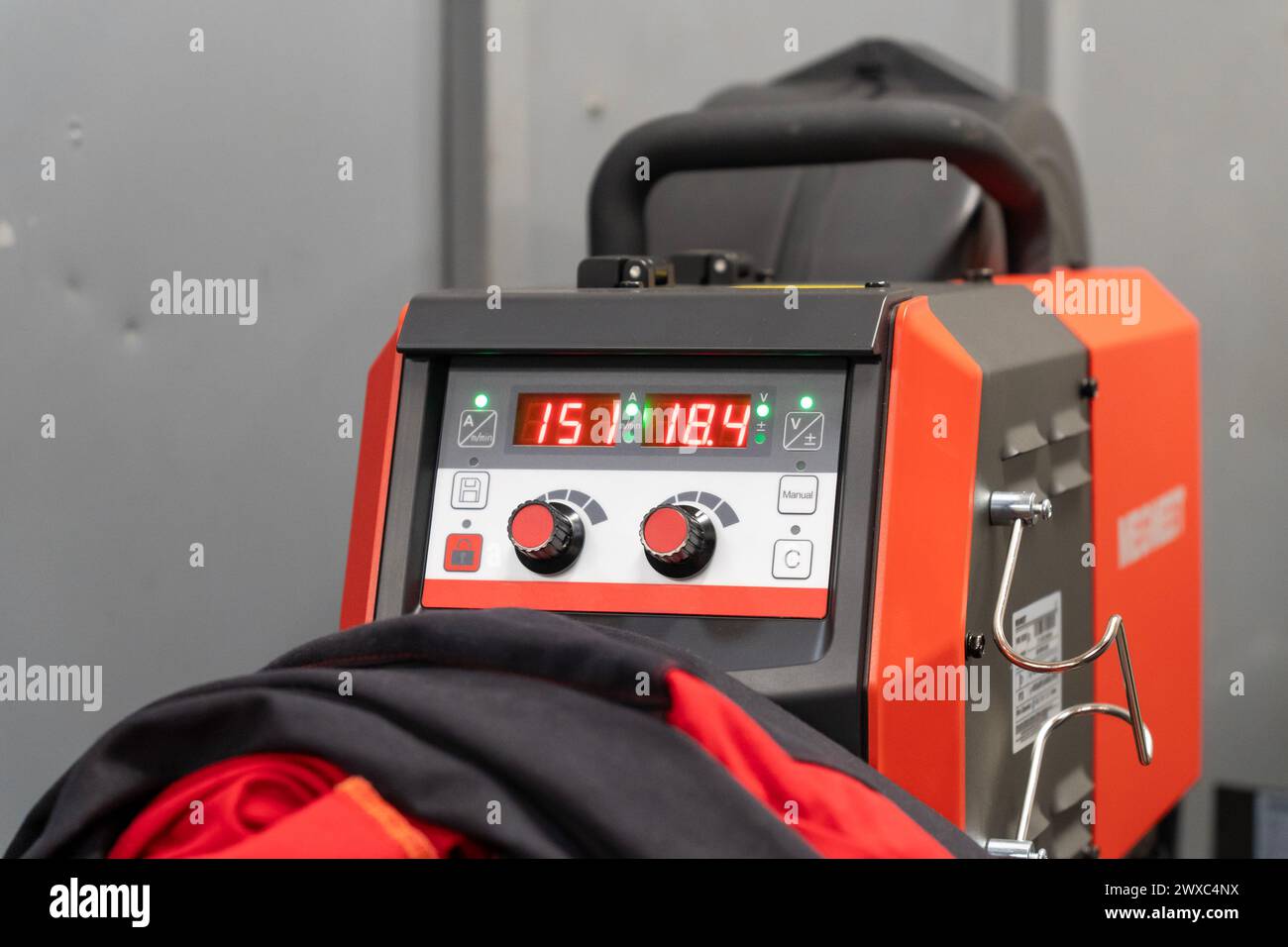 Red welding machine with digital displays and buttons Stock Photo - Alamy