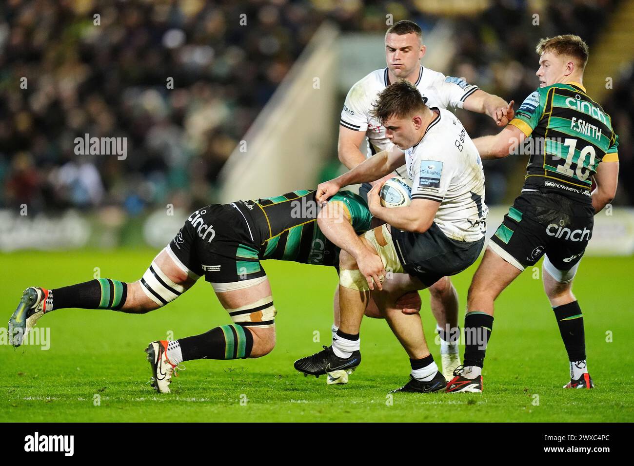 Saracens’ Theo Dan is tackled by Northampton Saints' Sam Graham during ...