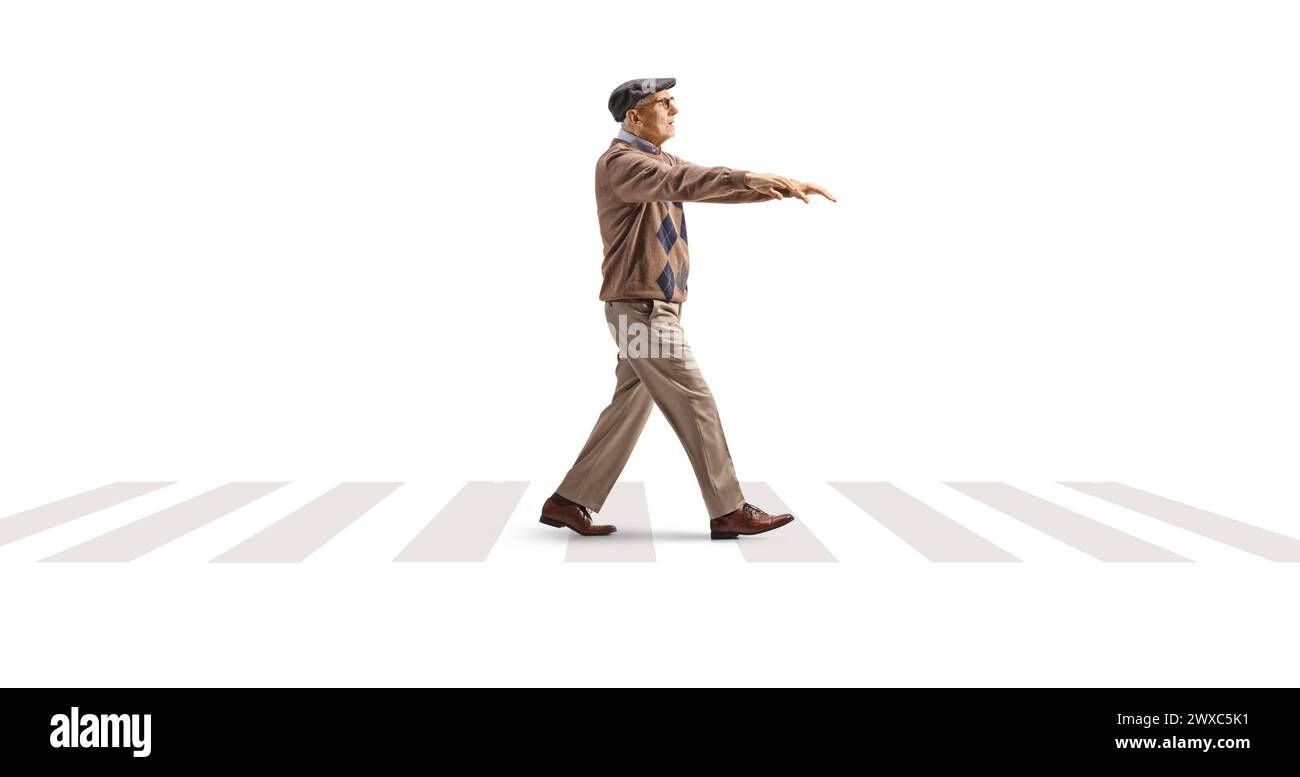 Full length profile shot of an elderly man sleepwalking at a pedestrian ...