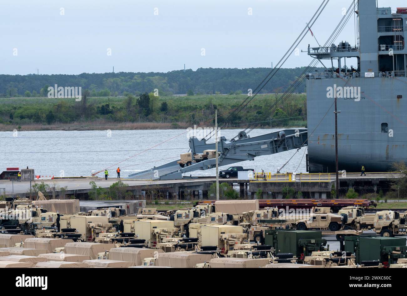 A U.S. Army Humvee is driven onto the USNS Charlton at Joint Base ...