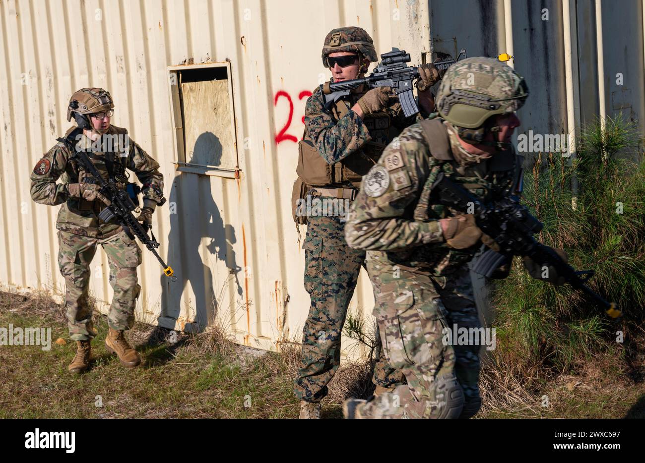 Members of team 7 perform close-quarters battle maneuvers during ...