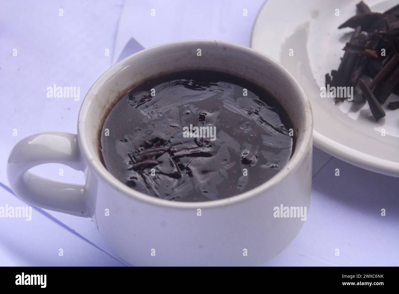 hot chocolate drink in a white cup. Its thick texture is drunk when it ...