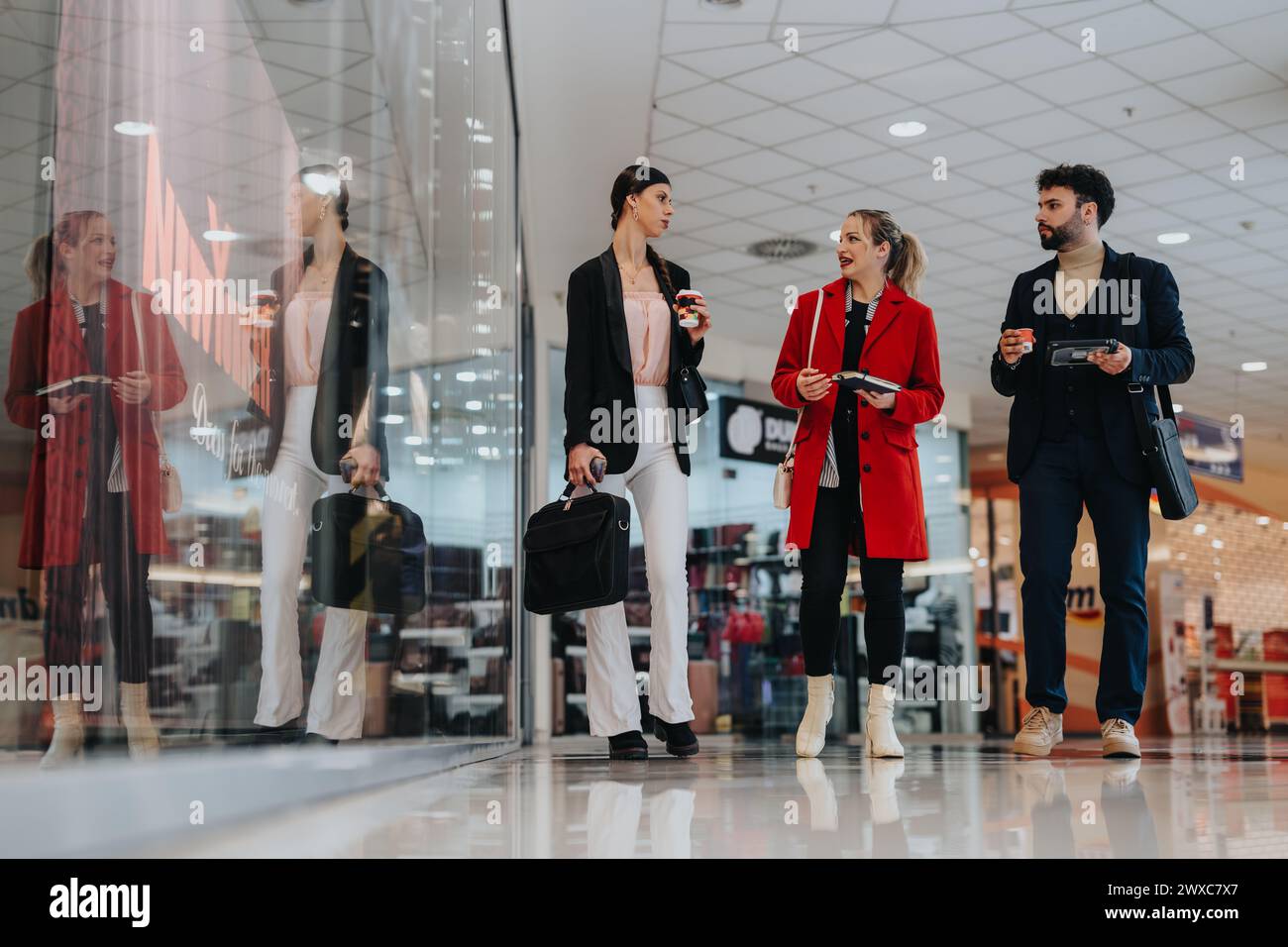 Business professionals networking over coffee in a shopping mall Stock ...
