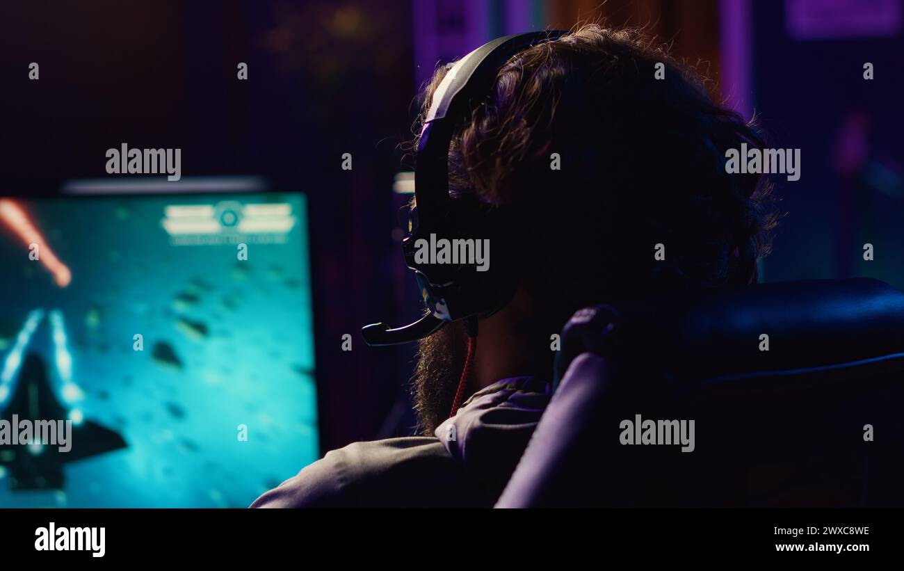 Man plays online multiplayer spaceship videogame with friends, using ...