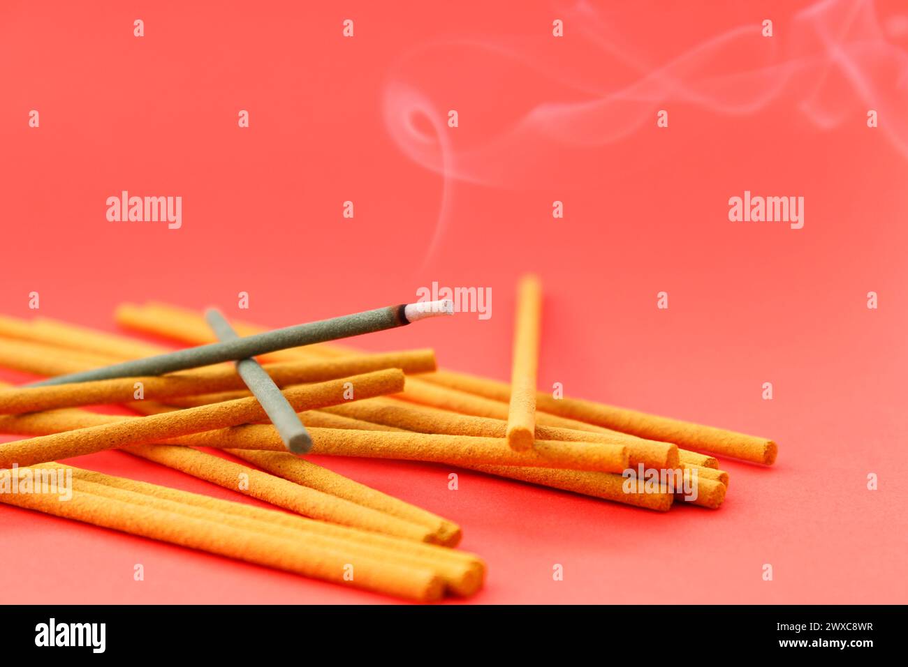 Incense sticks of different colors Stock Photo - Alamy