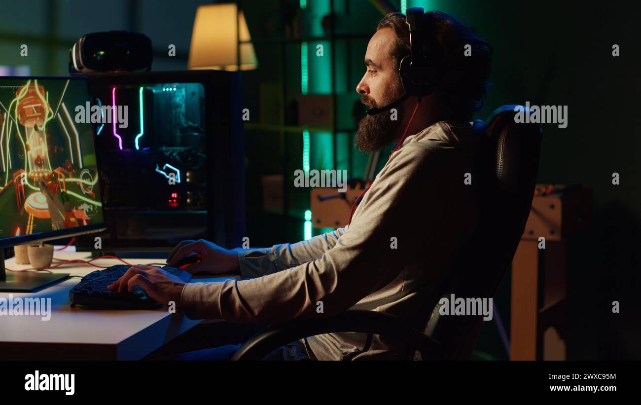 Man plays first person shooter videogame with internet teammates ...