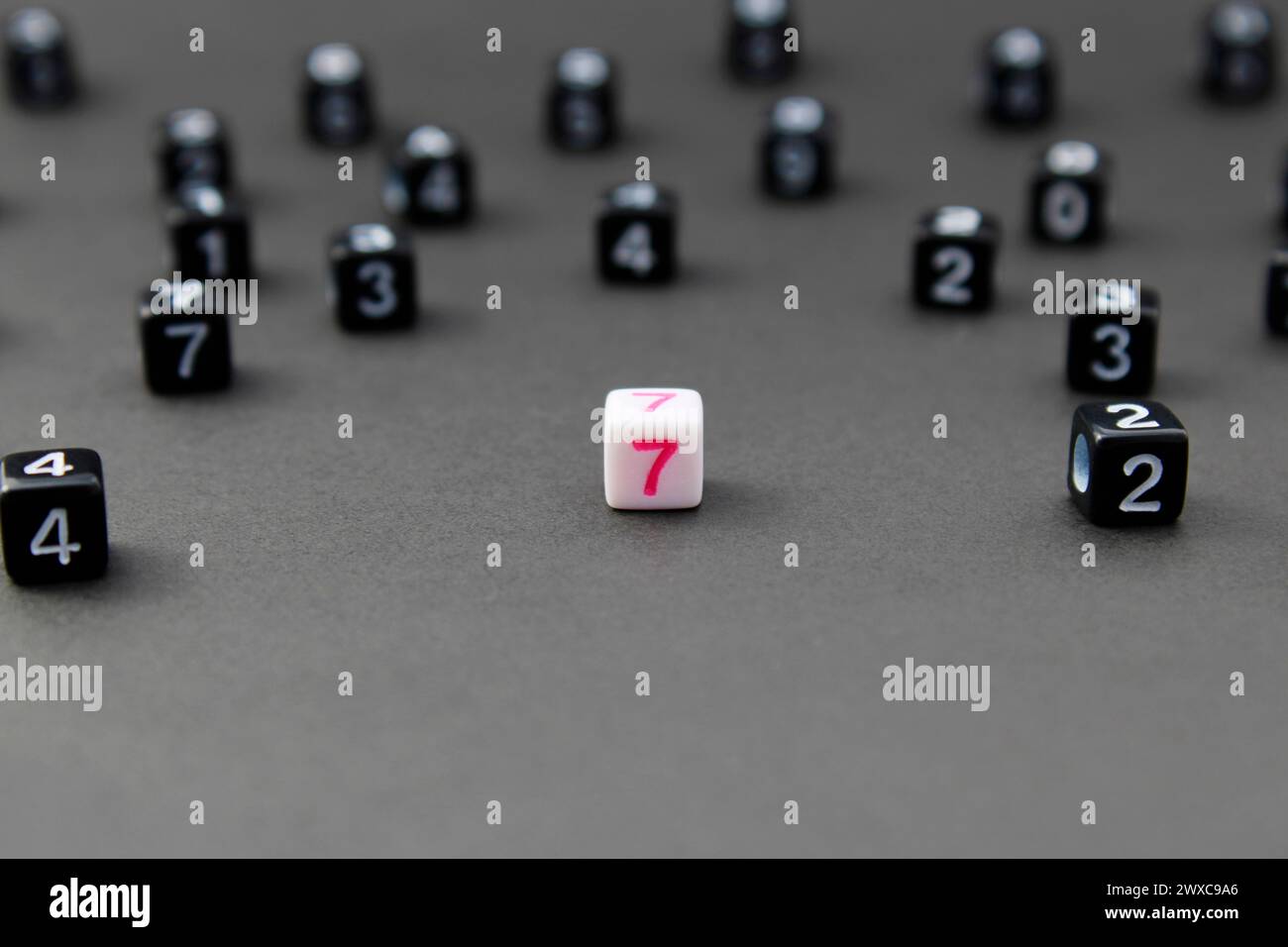Cube with number that differs from the group by its color Stock Photo ...