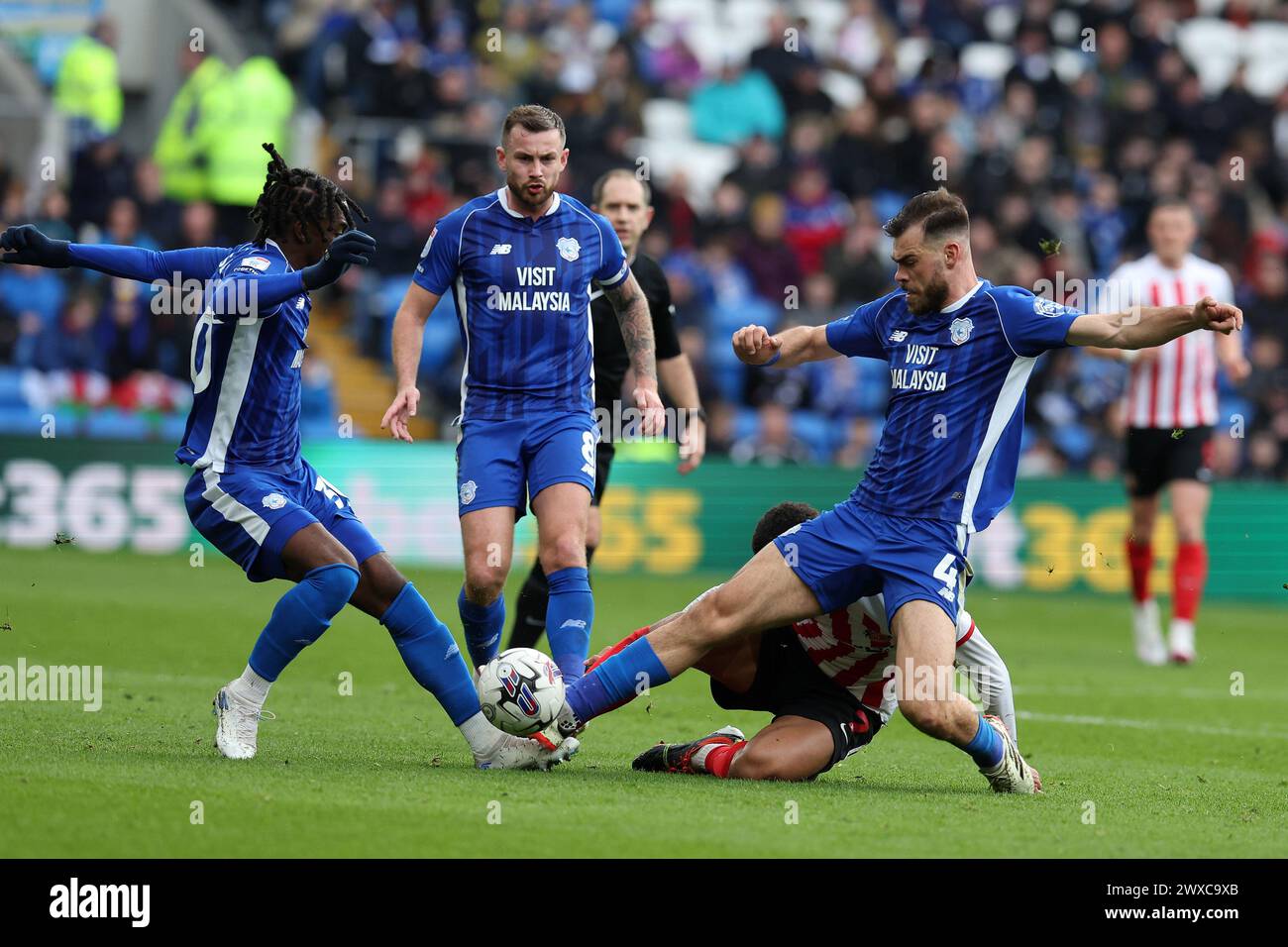 Cardiff, UK. 29th Mar, 2024. Dimitris Goutas of Cardiff city (r) & Josh ...