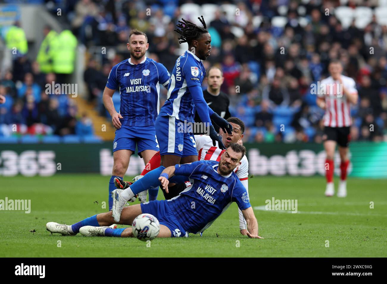 Cardiff, UK. 29th Mar, 2024. Dimitris Goutas of Cardiff city & Josh ...